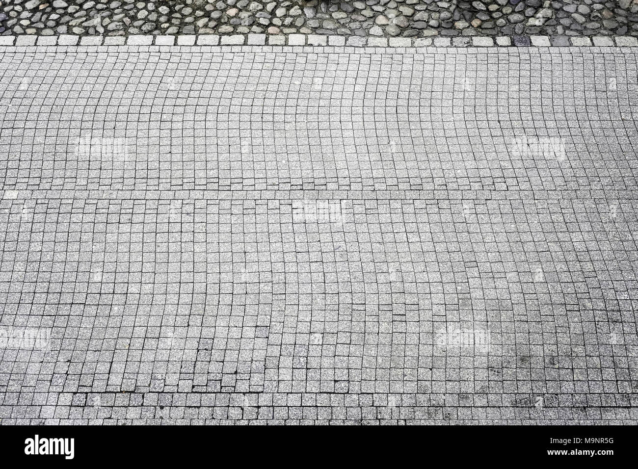 Cobblestone street pavement seen from above Stock Photo - Alamy