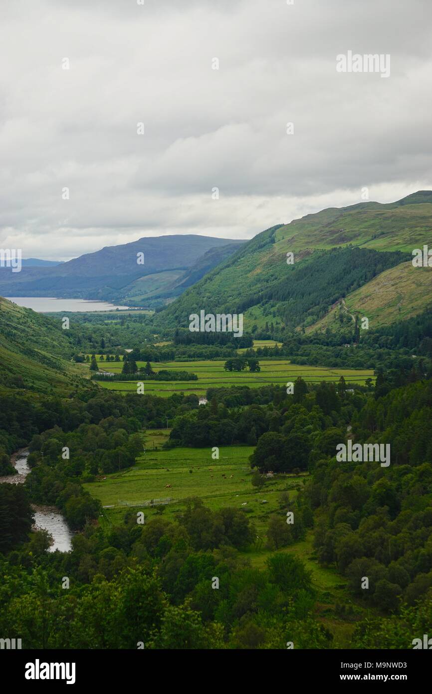Farms nestled in a valley in the Scottish Highlands. View of Little ...