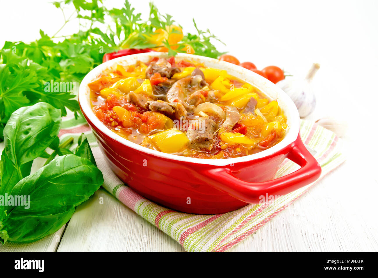 Ragout of turkey meat, tomatoes, yellow sweet pepper and onions with ...