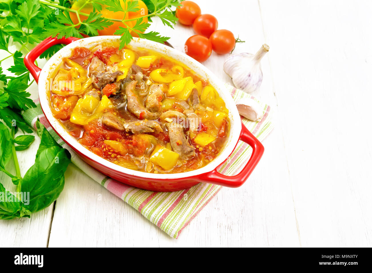 Ragout of turkey meat, tomato, yellow sweet pepper and onion with sauce ...