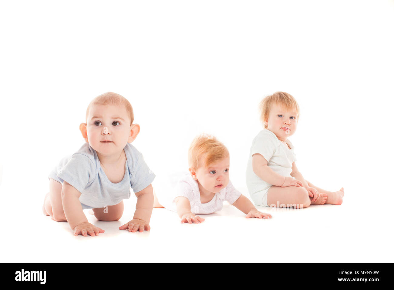 Threee babies isolated Stock Photo - Alamy