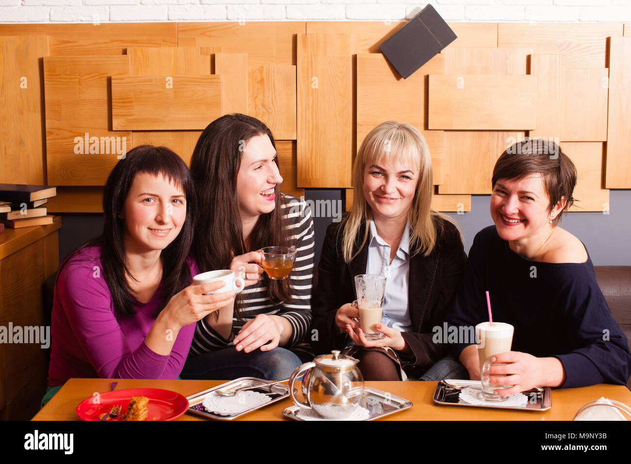 Informal meeting friends in cafe Stock Photo - Alamy