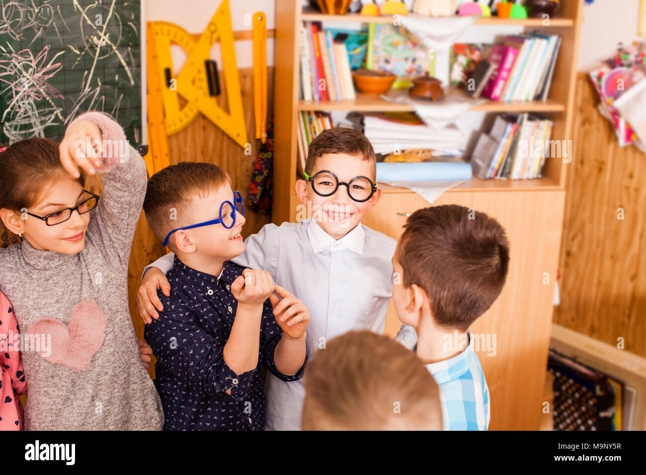 Schoolchildren in fun glasses Stock Photo - Alamy