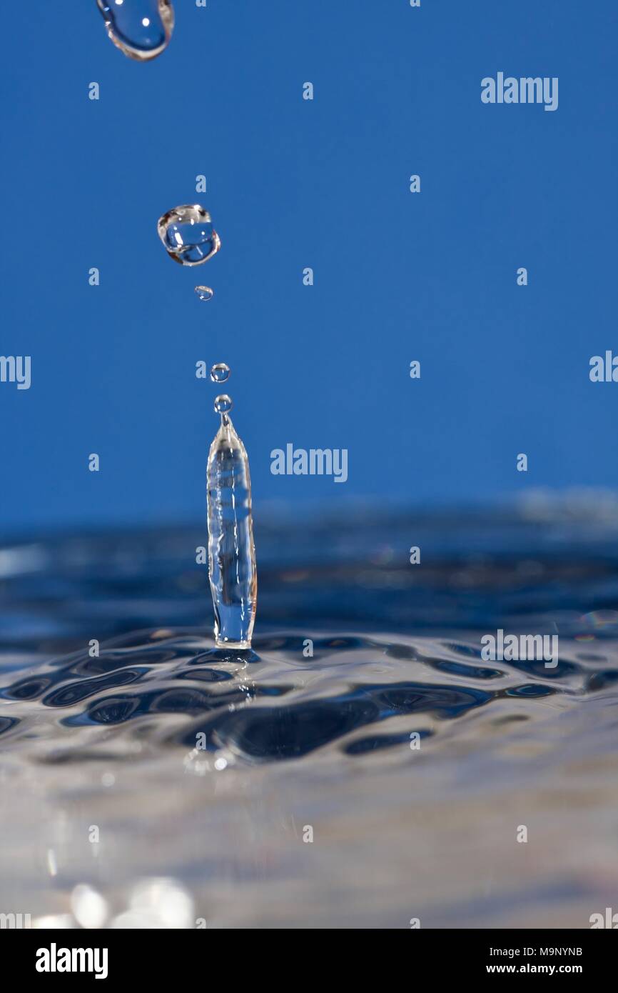 Splash, a drop falling in the water Stock Photo - Alamy