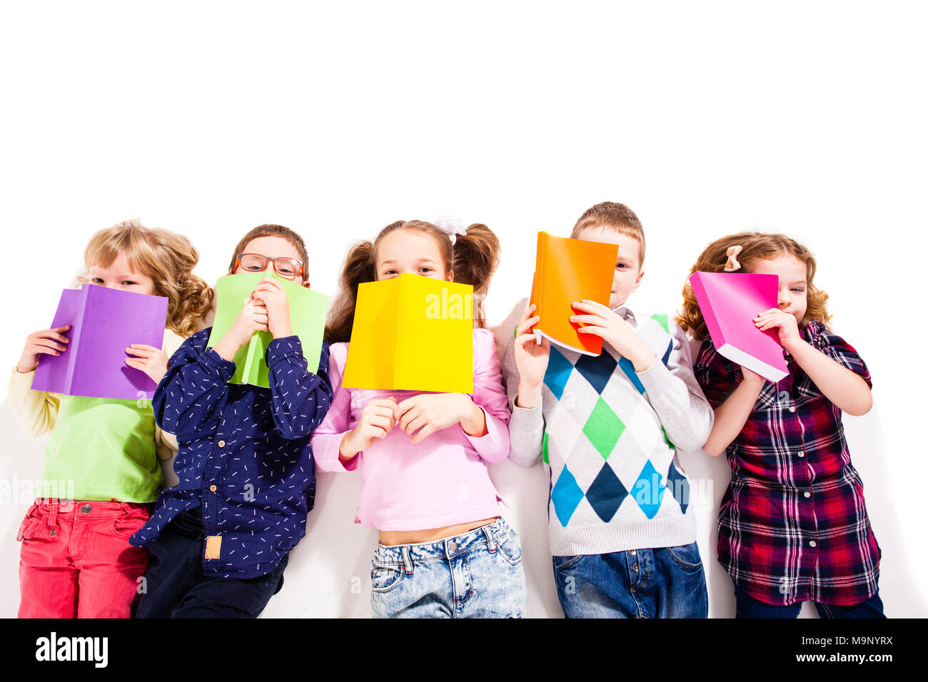 The cute children with books Stock Photo - Alamy