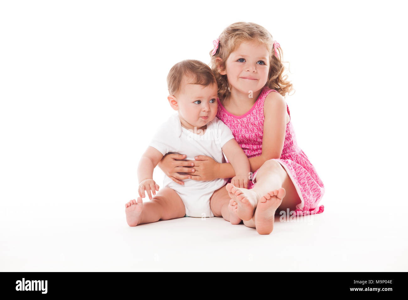 Two sisters isolated Stock Photo - Alamy
