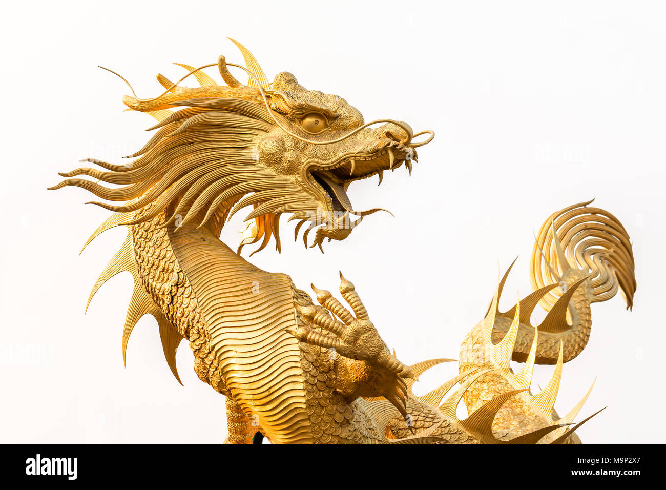 Golden dragon statue on white background Stock Photo - Alamy