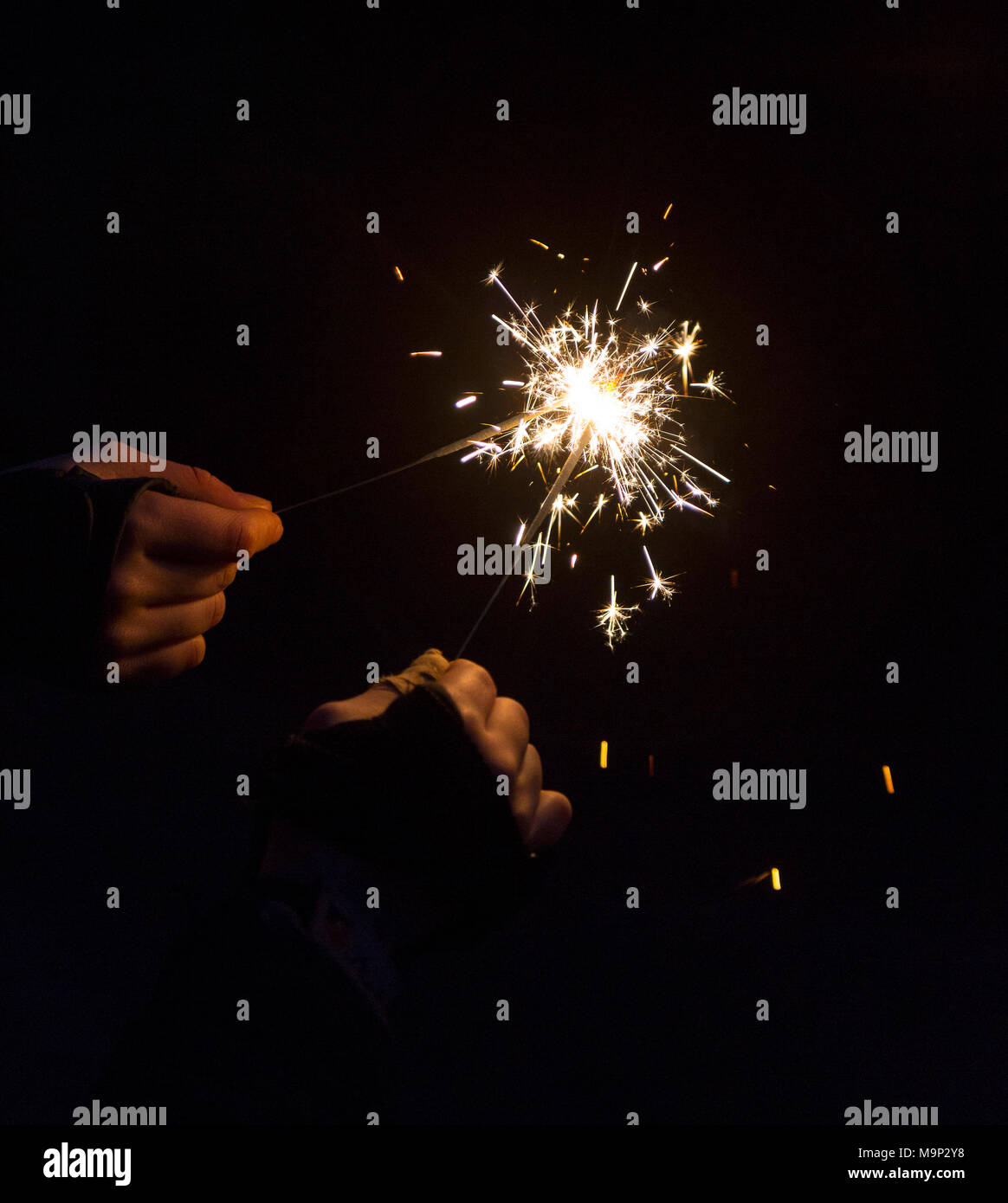 Burning sparklers in hands, symbil image party, fireworks, New Year's ...