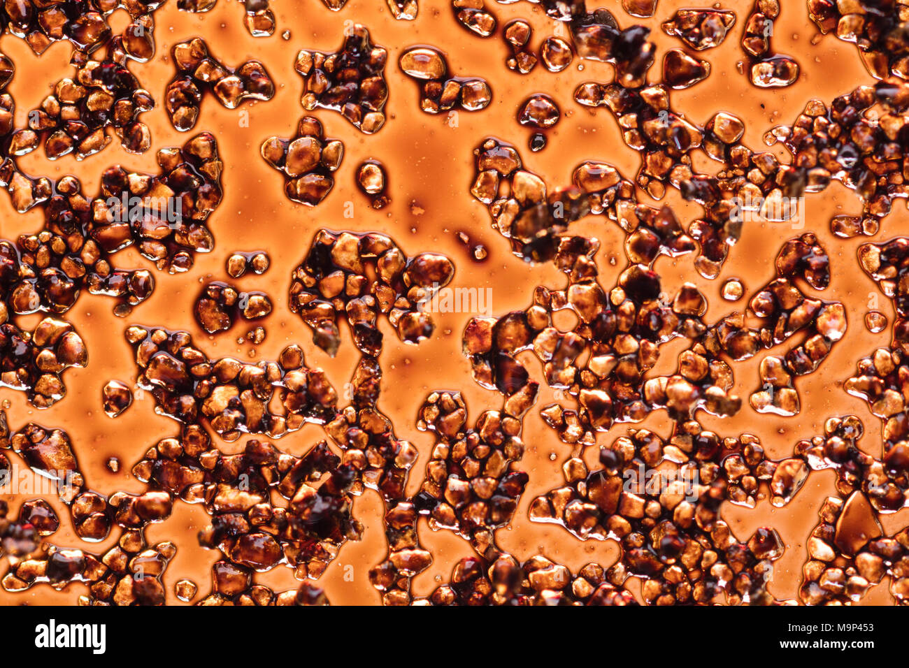 Each grain of oil sand is made of a grain of sand surrounded by a layer ...
