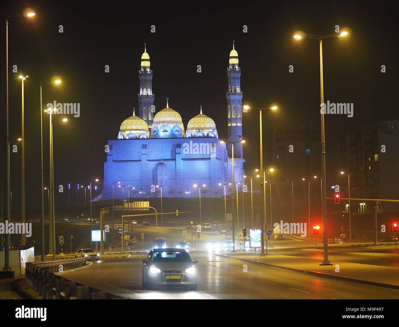 Traffic in front of illuminated Mohammed Al Ameen Mosque, night view ...