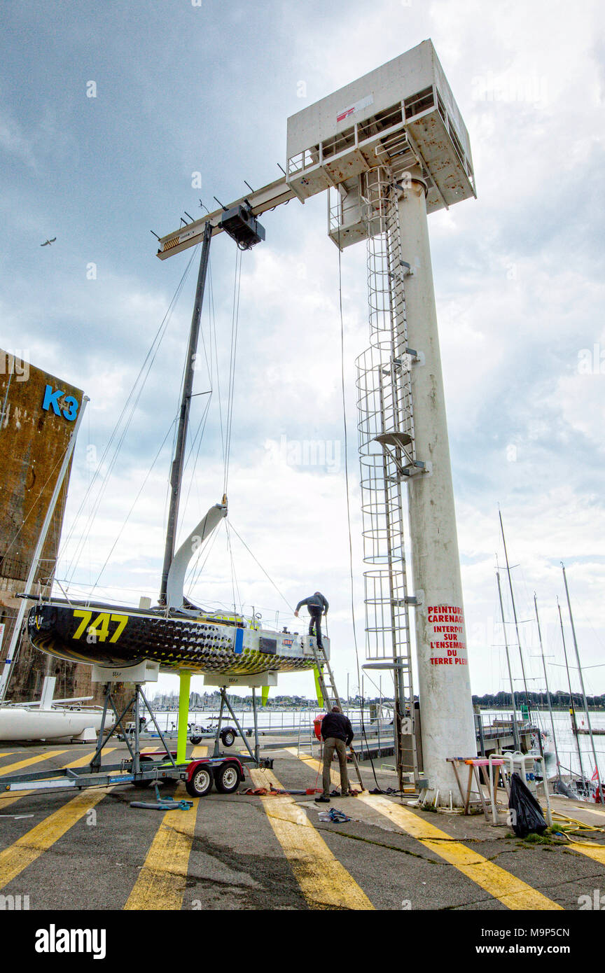 Two men are lifting the SEAir Mini 747 to the water with a crane. The 6 ...