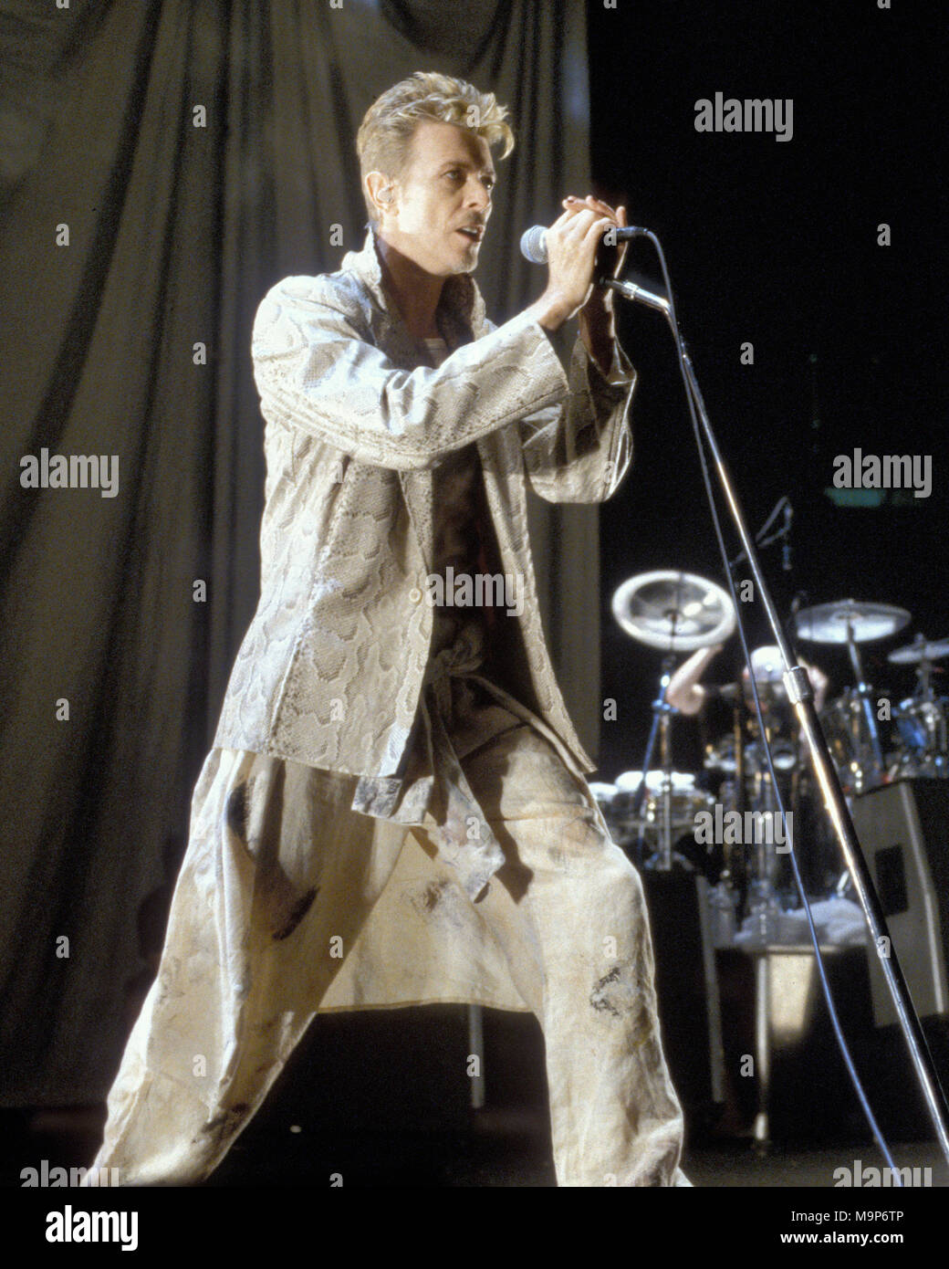 EAST RUTHERFORD, NJ - SEPTEMBER 27: David Bowie performs with Trent ...