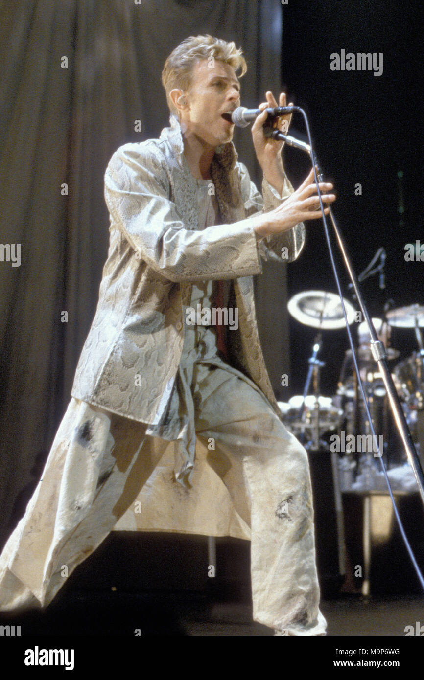 EAST RUTHERFORD, NJ - SEPTEMBER 27: David Bowie performs with Trent ...