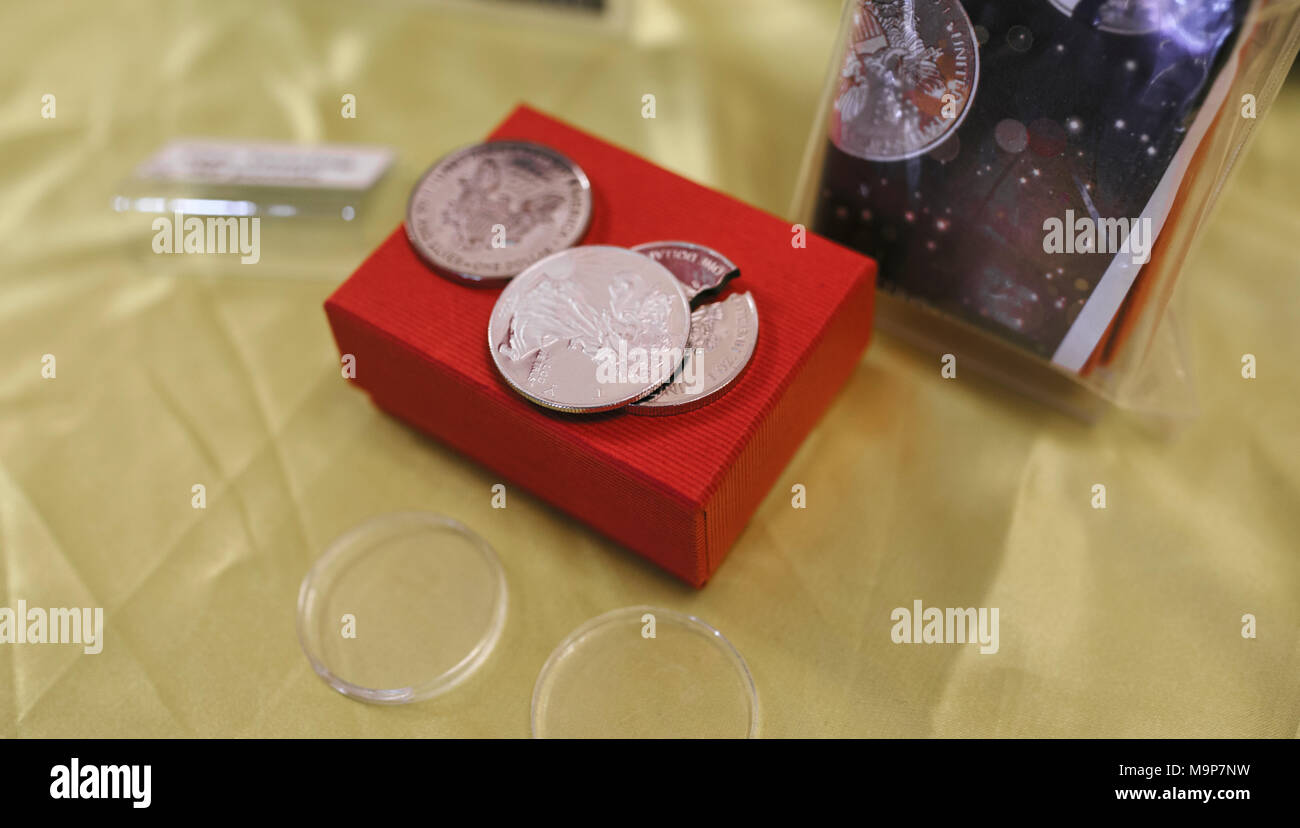 Magician coins hi-res stock photography and images - Alamy