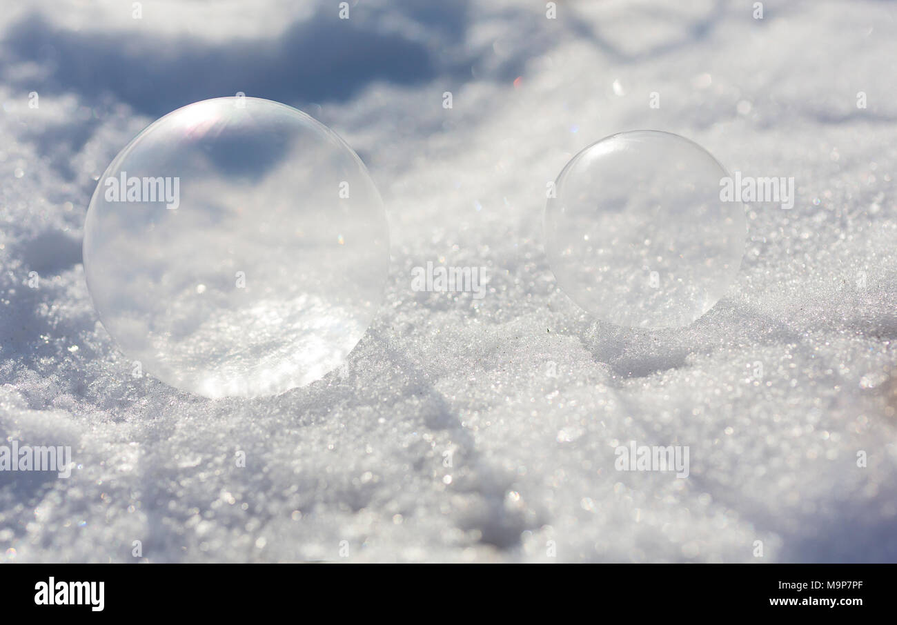 Frozen soap bubbles in the snow Stock Photo - Alamy