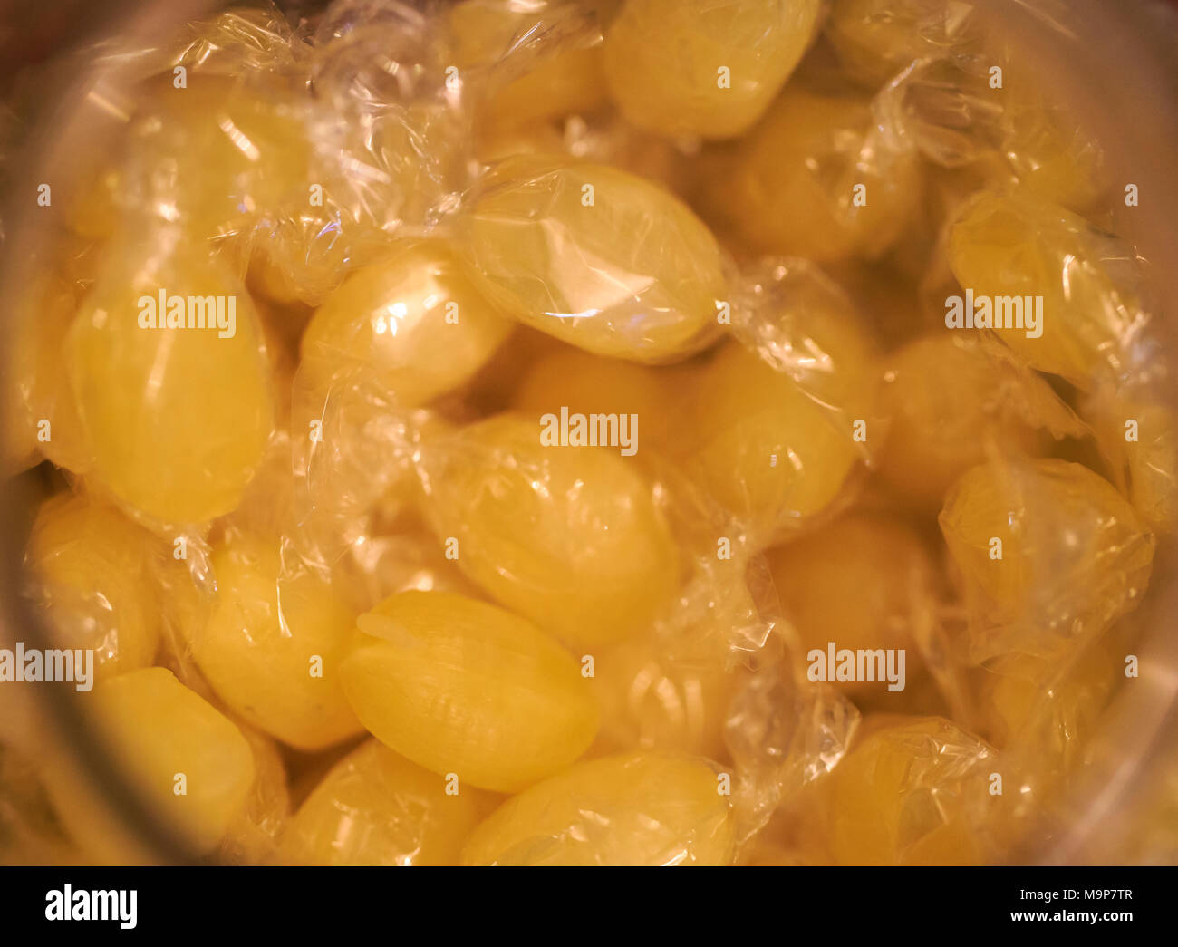 Group of yellow candies Stock Photo - Alamy
