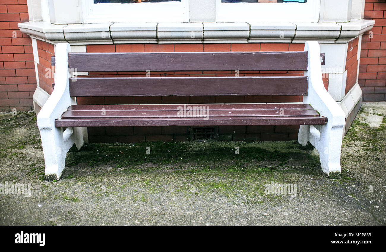 Wooden bench in the street Stock Photo - Alamy