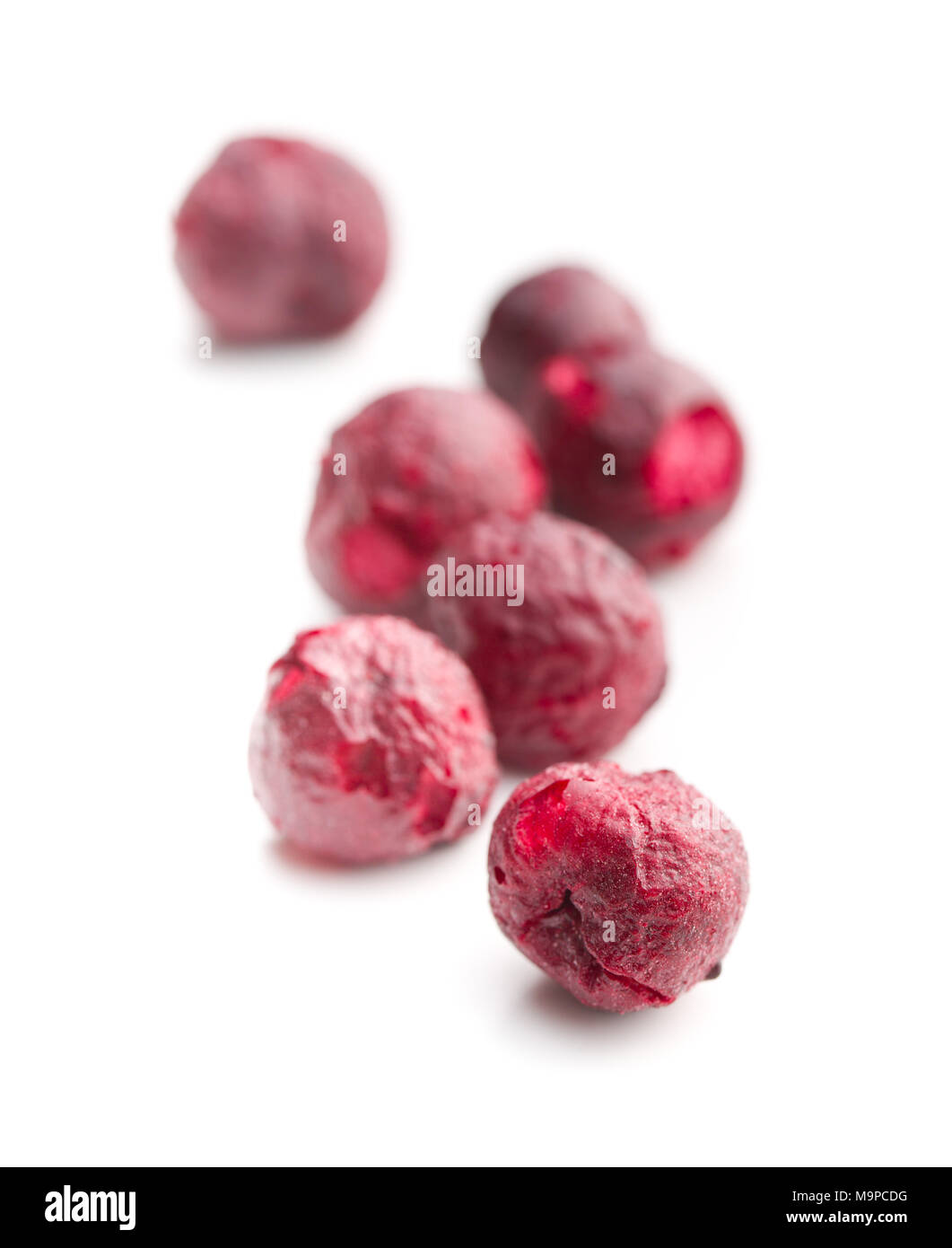 Freeze dried cherries isolated on white background Stock Photo - Alamy