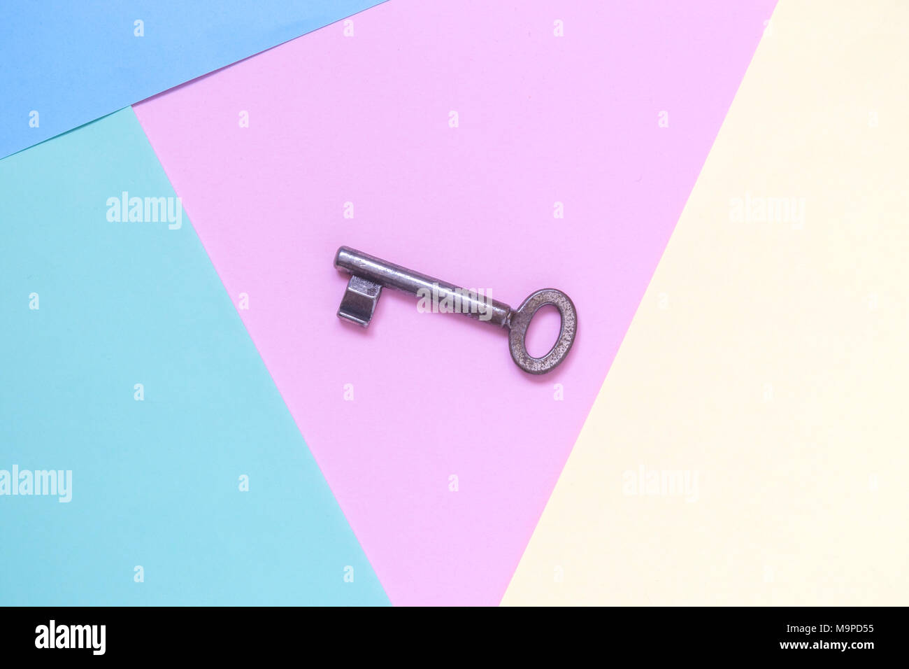 Old key on colorful pastel background minimal concept Stock Photo - Alamy