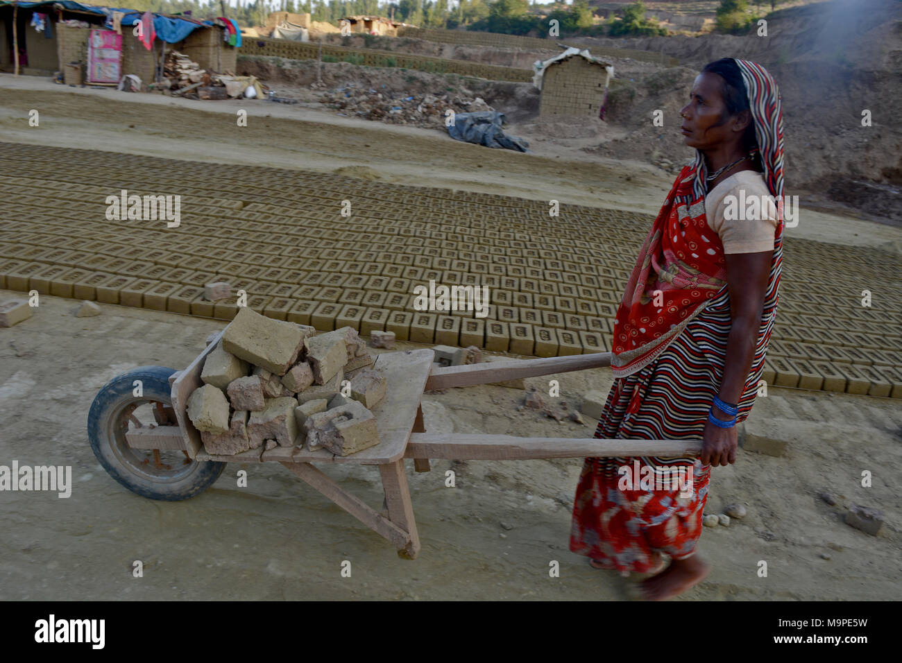 Non-Kashmiri laborer woman working inside a brick kiln in a village of ...