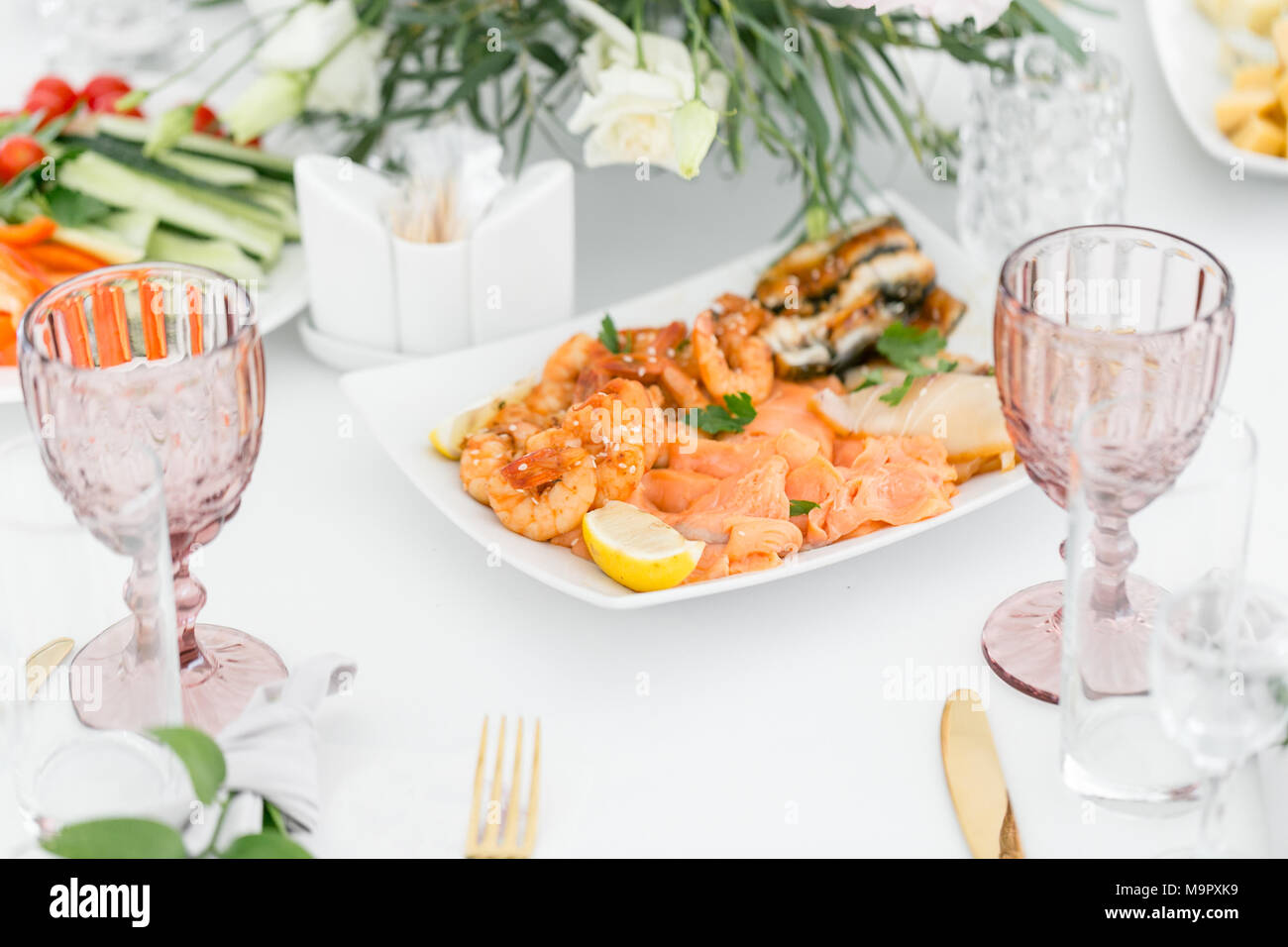 Fish platter. Plate with seafood on the table, snacks at the banquet ...