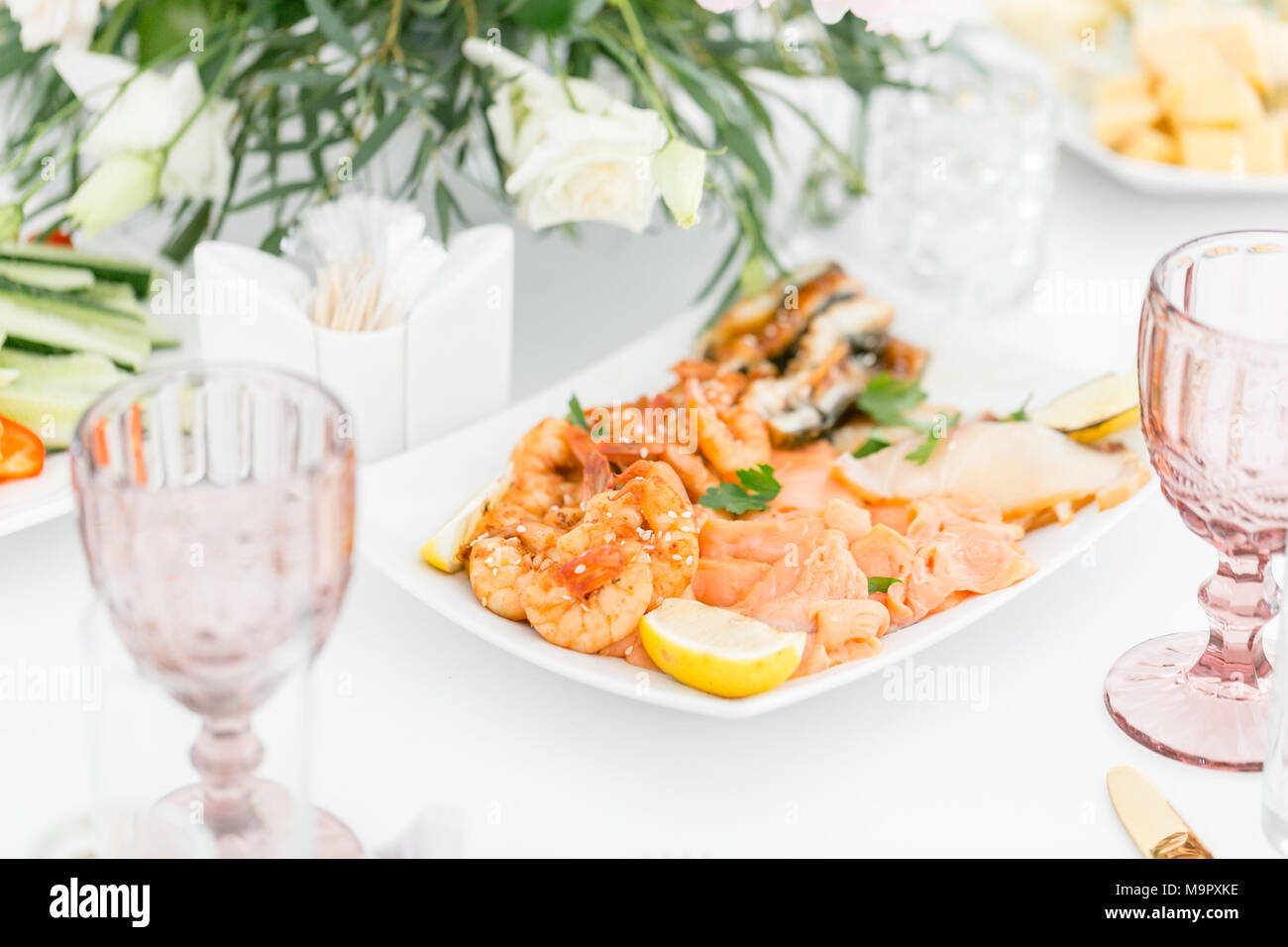 Fish platter. Plate with seafood on the table, snacks at the banquet ...