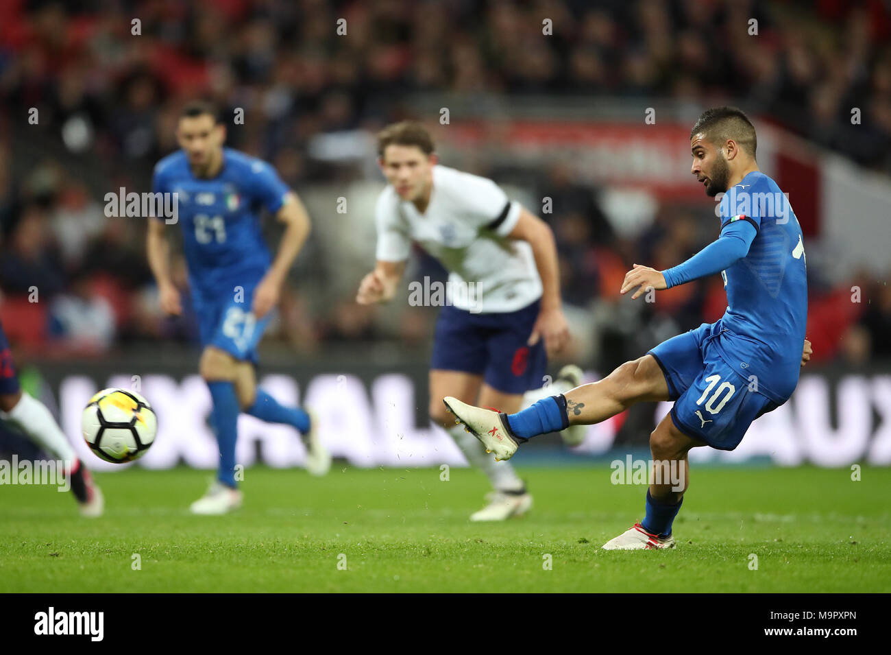Italy's Lorenzo Insigne scores his side's first goal of the game from ...