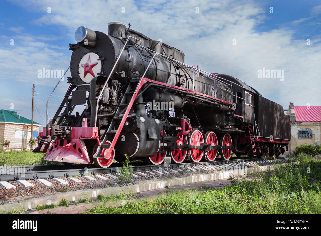 Monument to Russian steam locomotive, built in 1951, The station square ...