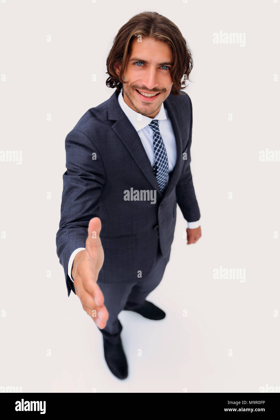 Business man offer and give hand for handshake Stock Photo - Alamy