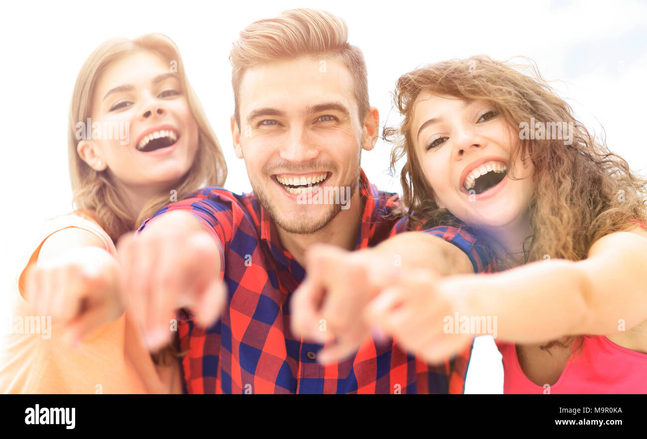 closeup of three happy young people showing hands forward Stock Photo ...