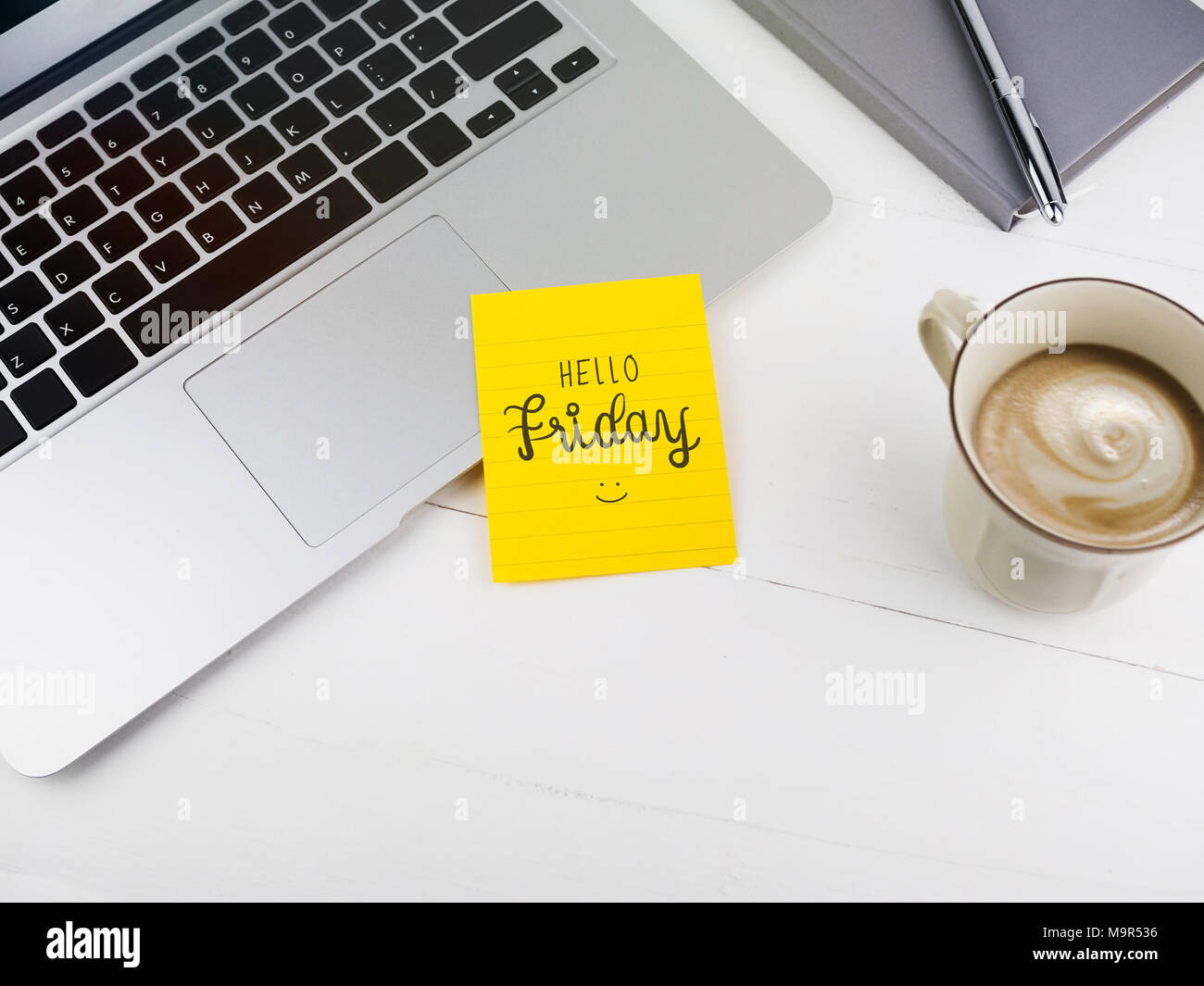 Hello Friday with smiley icon face on sticky note on desk Stock Photo ...