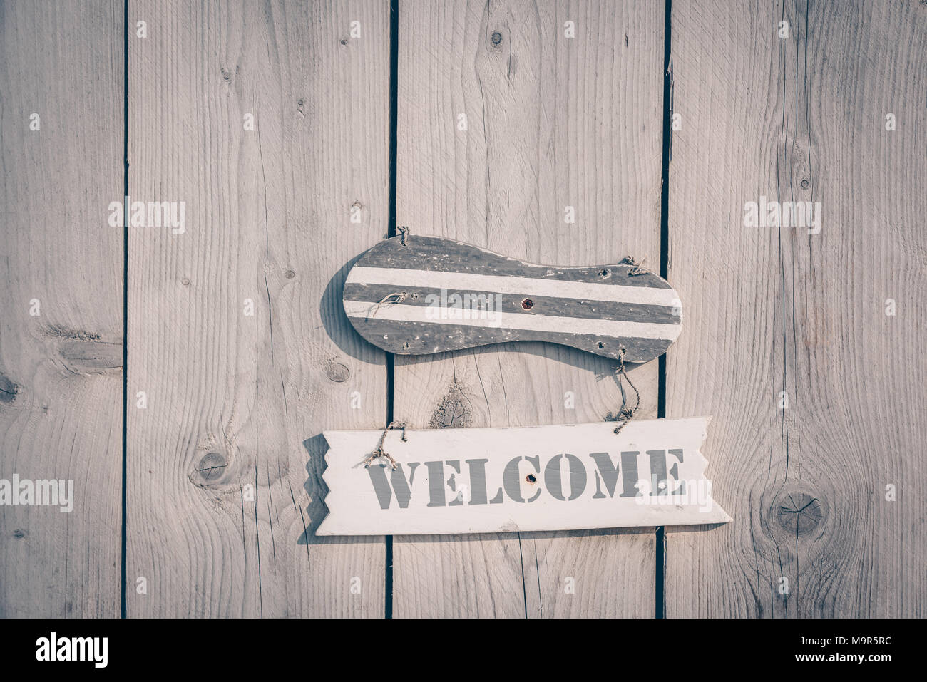 Wooden welcome sign in rustic style hanging on plank door Stock Photo ...