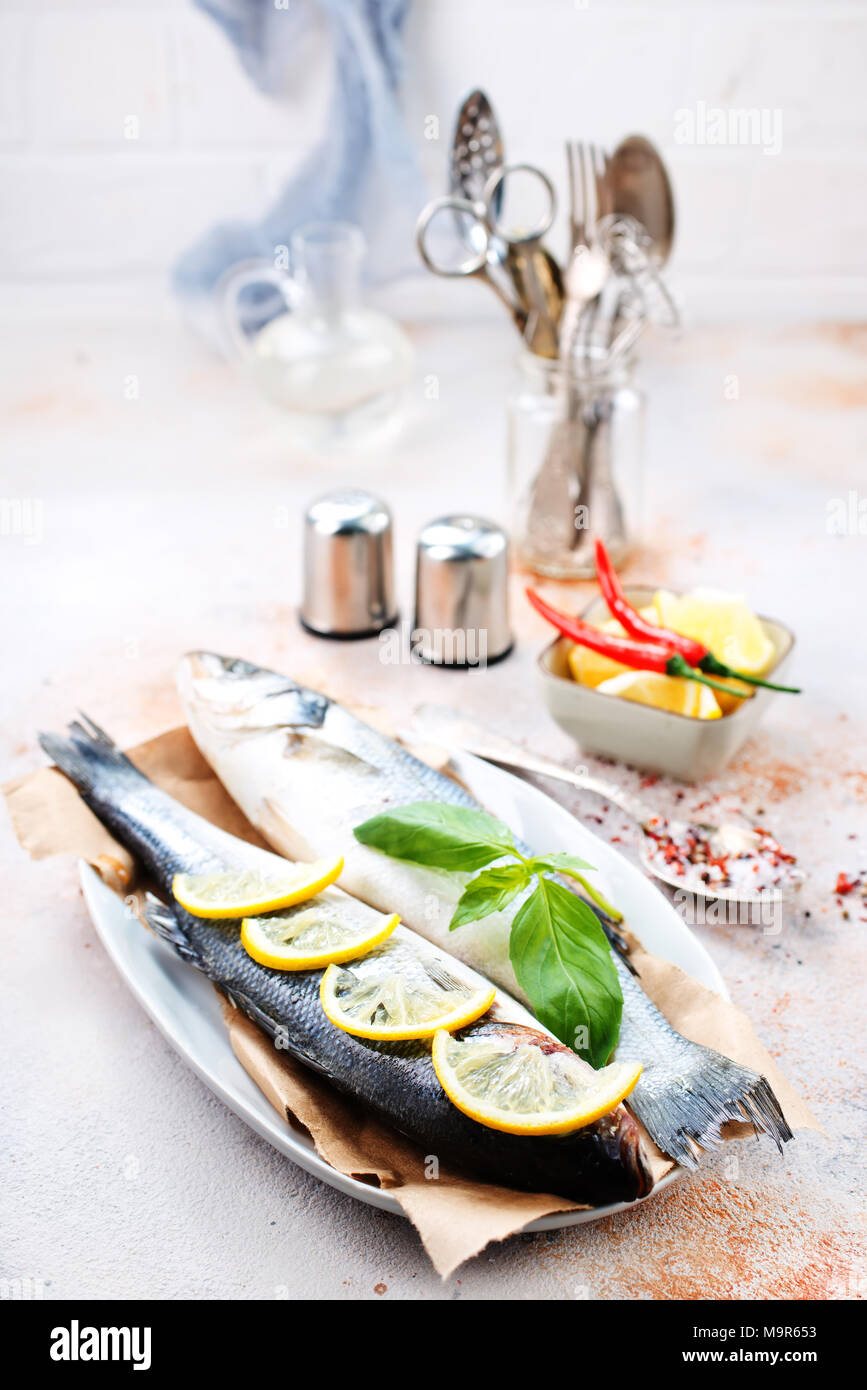 raw fish on plate, fish and aroma spices Stock Photo - Alamy