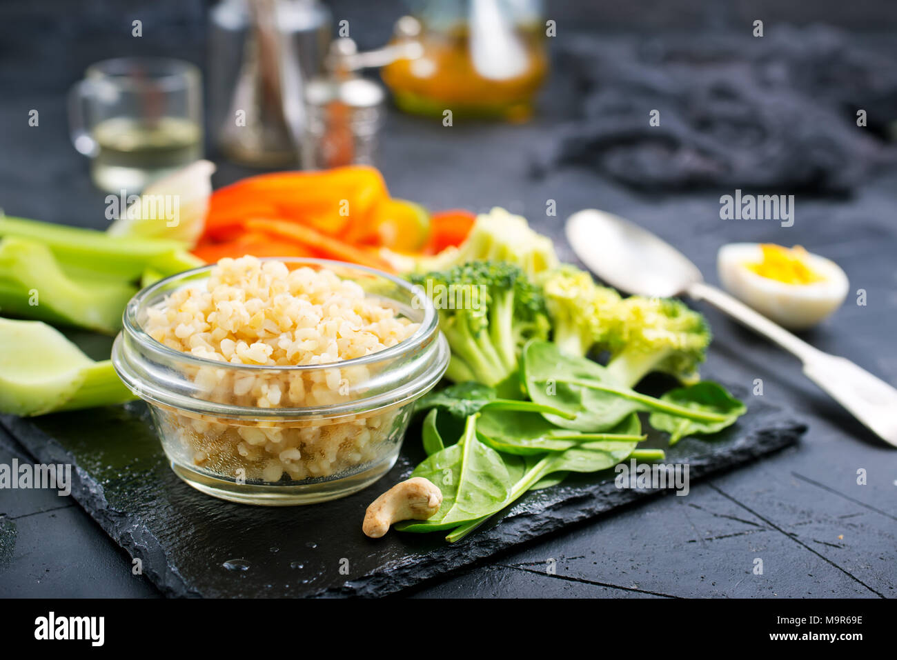diet food,boiled bulgur with vegetables and egg Stock Photo - Alamy