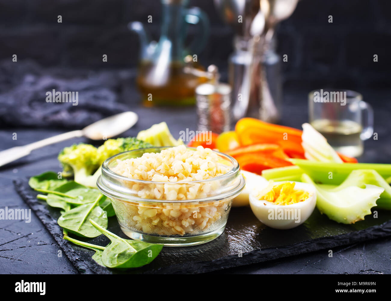 diet food,boiled bulgur with vegetables and egg Stock Photo - Alamy