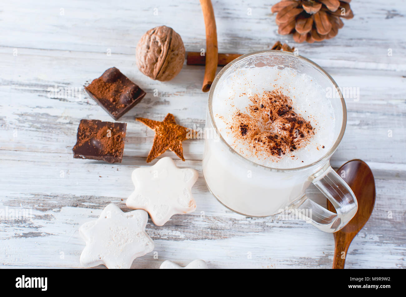 cup of hot cocoa or hot coffee latte with cinnamon, traditional ...