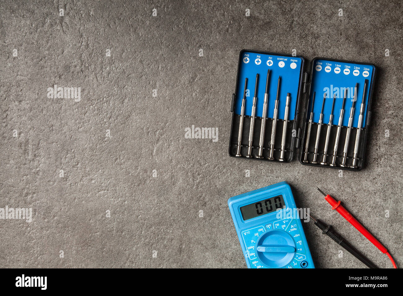 Digital multimeter on grey background Stock Photo - Alamy