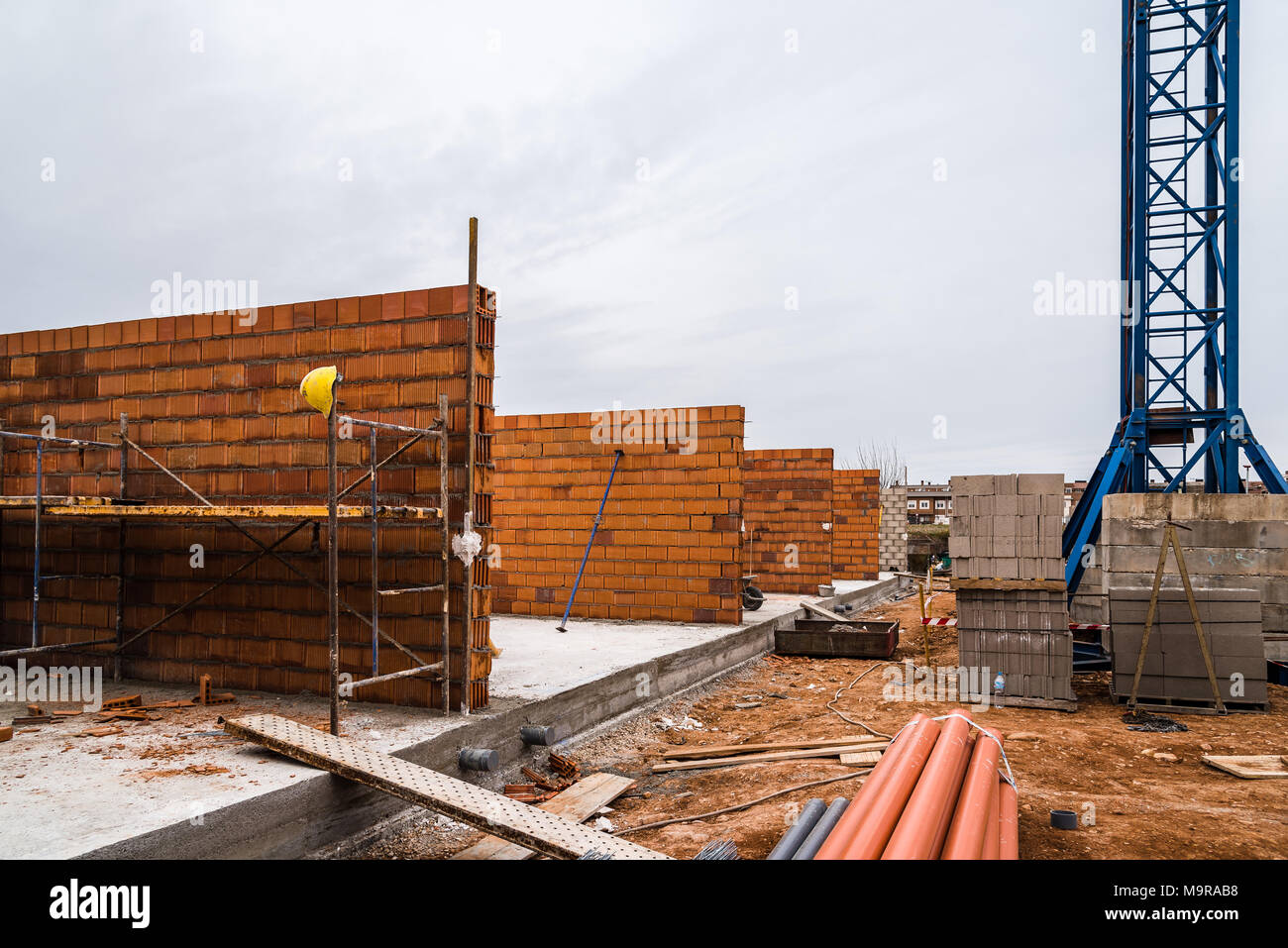Works of construction of thermal clay block walls in construction site ...