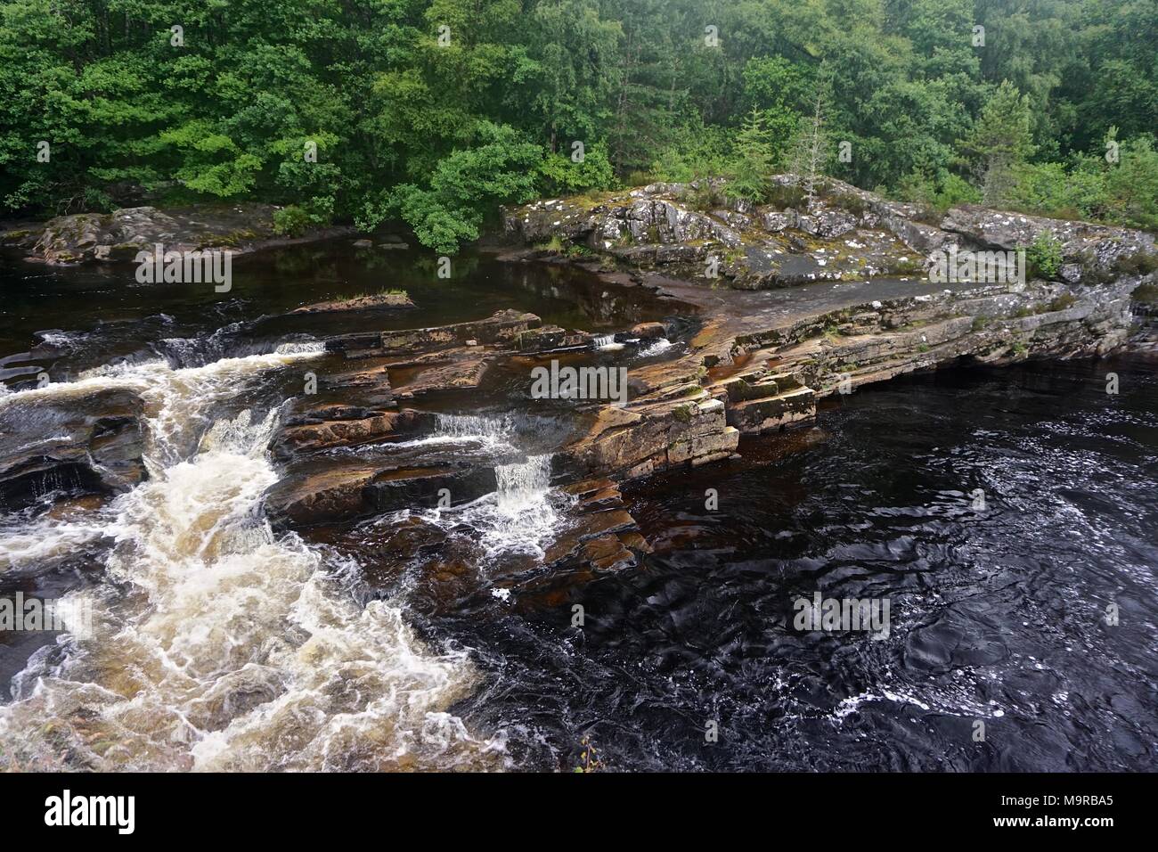Garve, Scotland, UK: Water flowing over stones at Black Water, a river ...