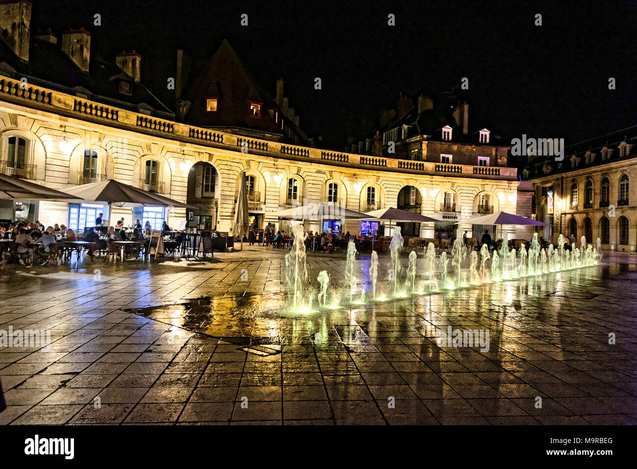 Night-time in the Place Liberacion, Dijon, Burgundy with fountains and ...