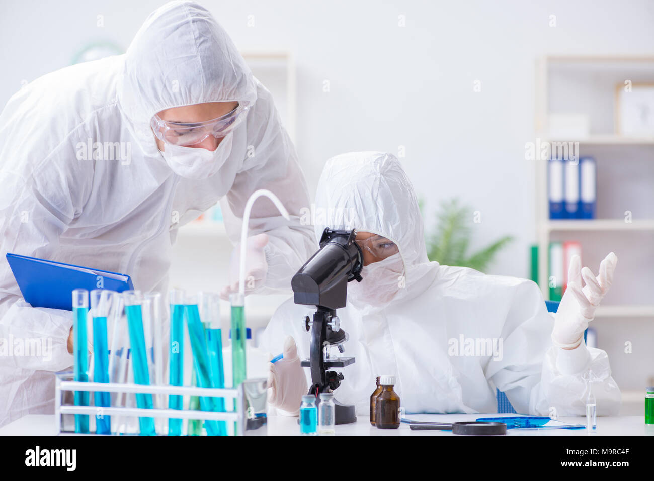 Two scientists working in the chemical lab Stock Photo - Alamy