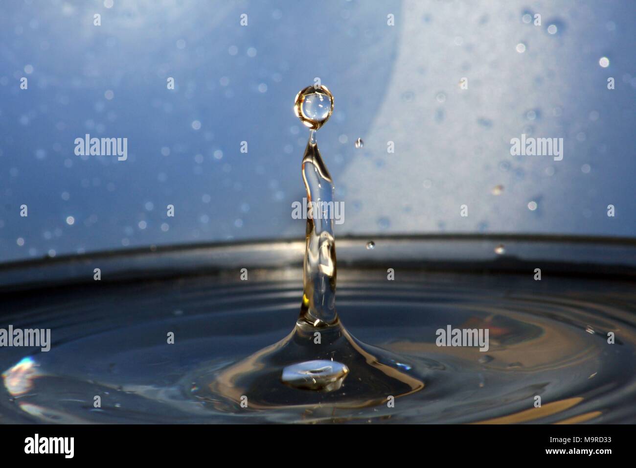 Splash, a drop falling in the water Stock Photo - Alamy