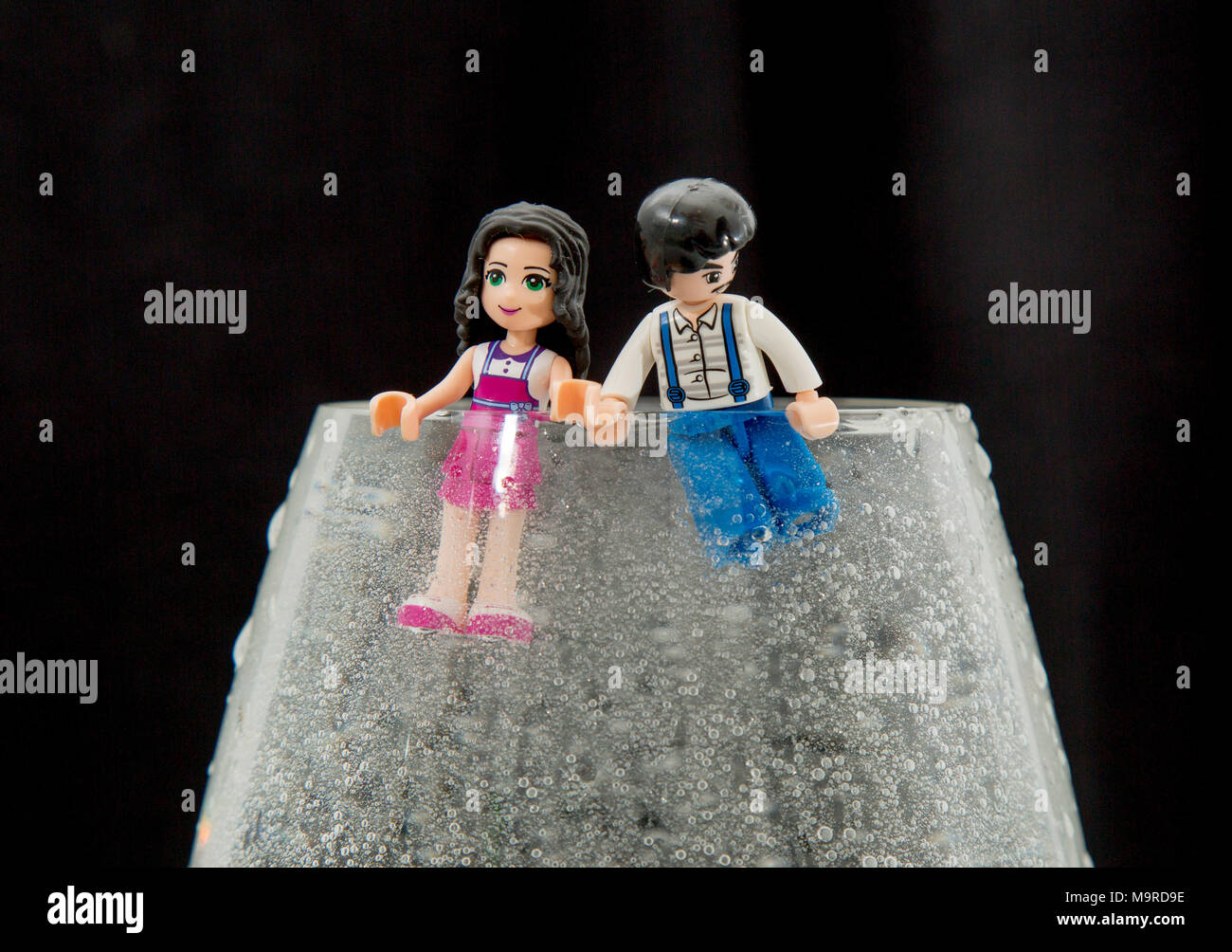 Lego toys in a a white wine glass with a water Stock Photo - Alamy