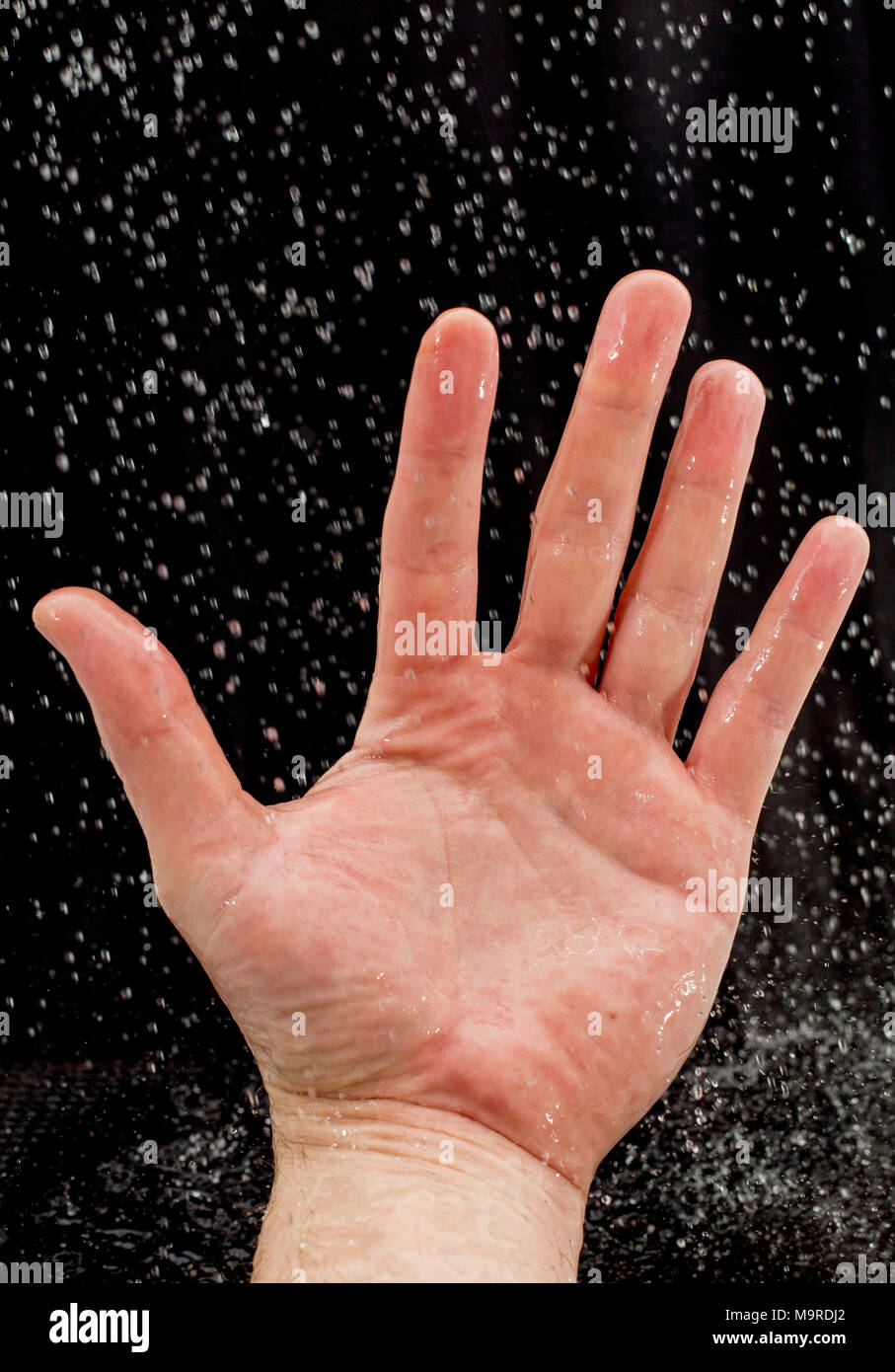 Arm in a shower Stock Photo - Alamy
