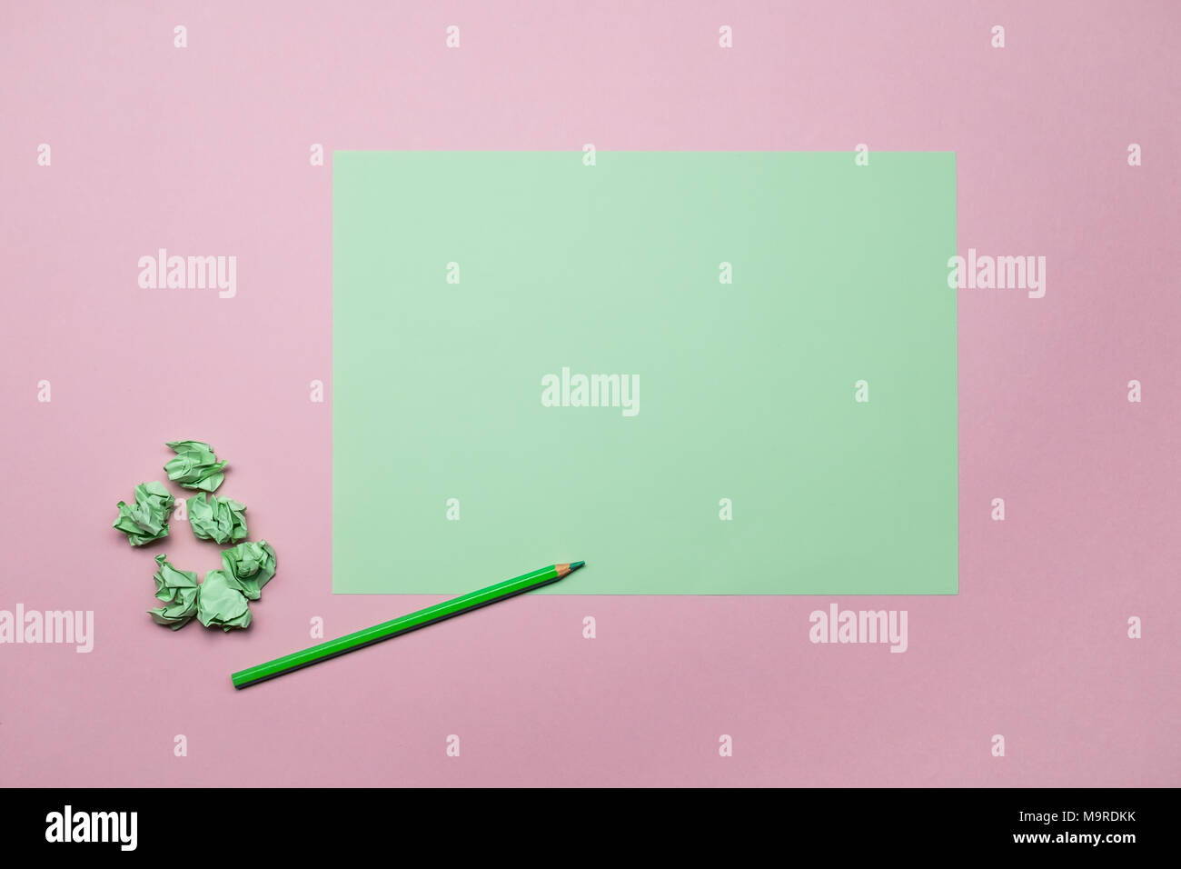 Two tone pink and green contrast color paper background with crumpled ...