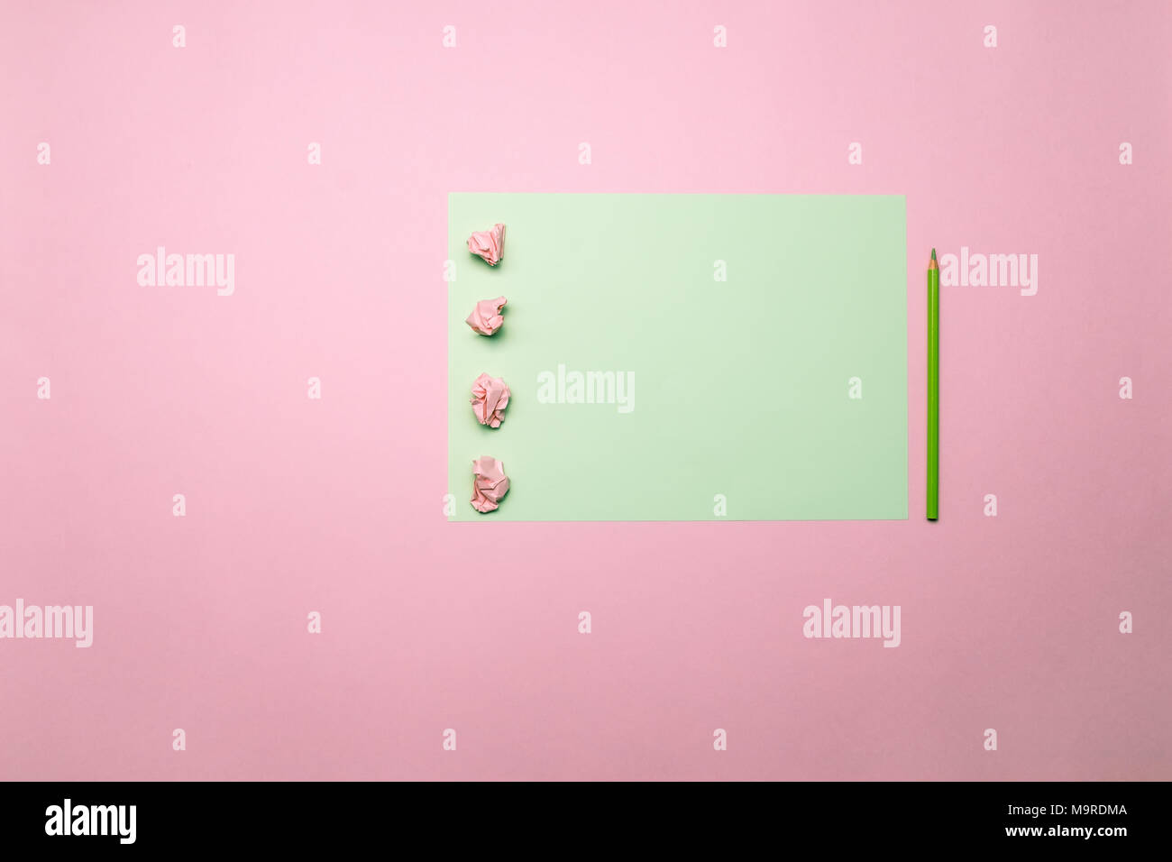 Two tone pink and green contrast color paper background with crumpled ...