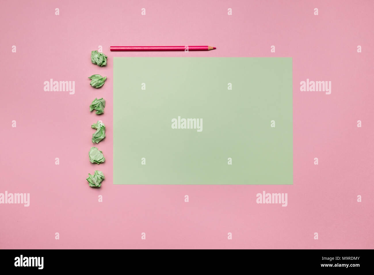 Two tone pink and green contrast color paper background with crumpled ...
