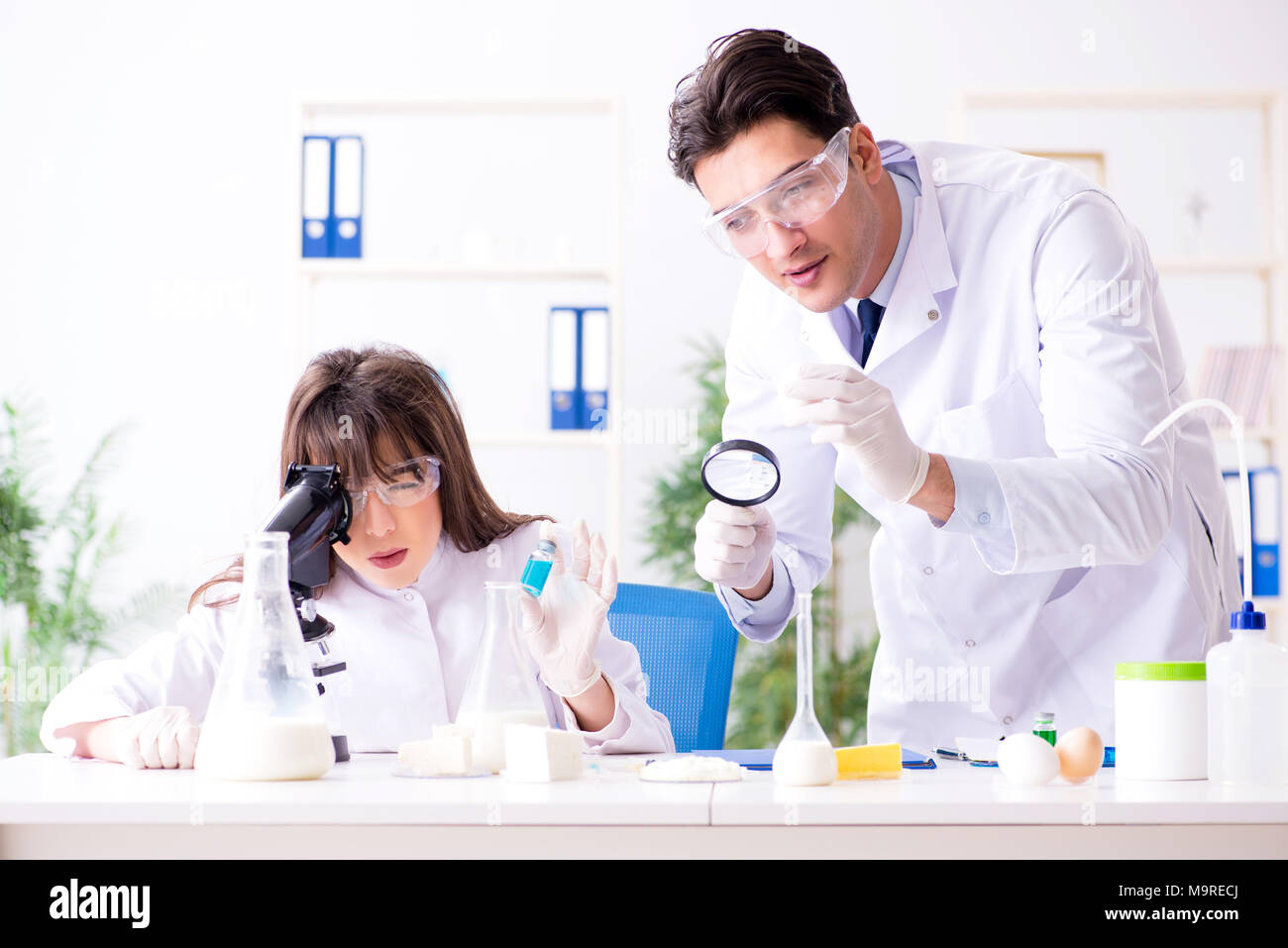 Two lab doctor testing food products Stock Photo - Alamy