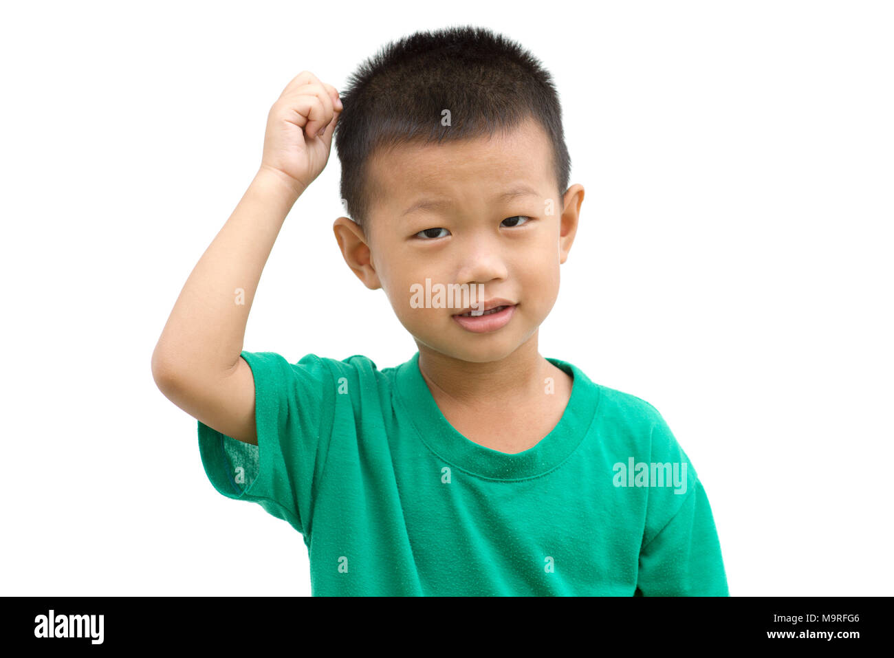 Happy Asian child pointing his hair and smiling. Portrait of young boy ...