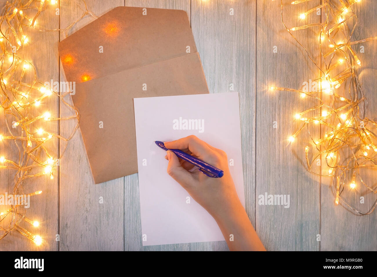 female hand writing a letter Stock Photo - Alamy